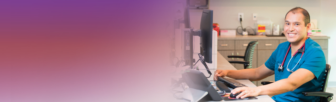 male nurse sitting at deak